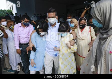 Bangladeshi American Sharif Imran and his two Japanese daughters coming ...