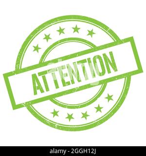 ATTENTION text written on green grungy vintage round stamp Stock Photo ...