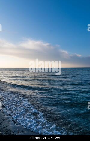 Wide deserted Baltic Sea beach in sunny windy weather, wind-moving ...