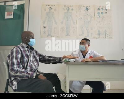 Kigali, Rwanda. 31st Aug, 2021. Patients wait outside consulting rooms ...