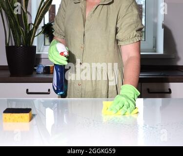 using disinfectant spray to clean table surface Stock Photo - Alamy