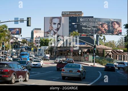 View of the Sunset Strip with cars and billboards in West Hollywood, CA ...