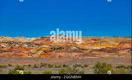 Wind eroded square hills, minarets, peaks, Efege mounds. Clean blue sky ...