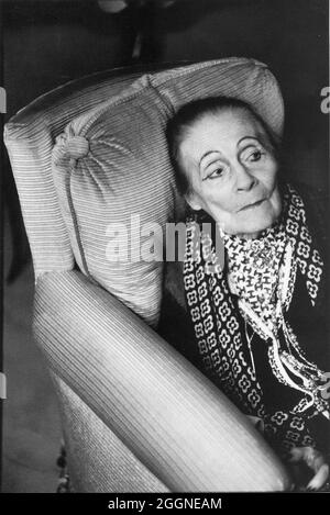 Portrait of Lilya Brik (1891-1978) in golden robe. The scarf designed ...