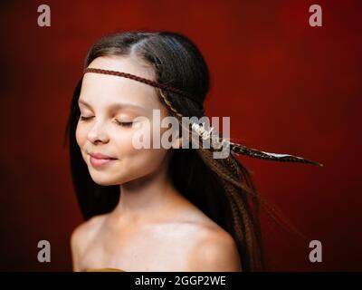 girl Indian ethnic hairstyle Apache red background Stock Photo - Alamy