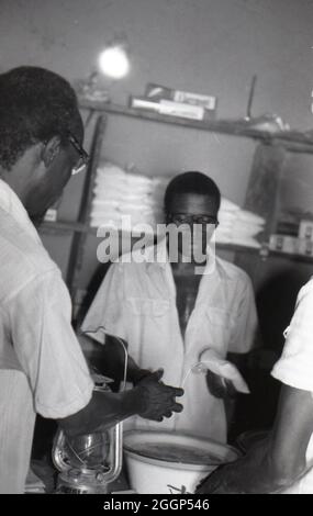 A group of men observing objects Stock Photo - Alamy