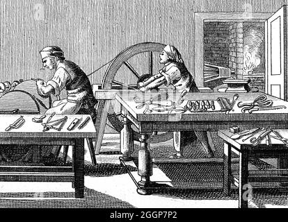 Engraving showing the making of surgical instruments. A forge is shown ...