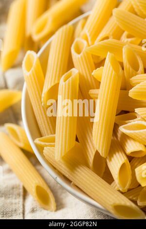 Homemade Raw Dry Penne Pasta in a Bowl Stock Photo - Alamy