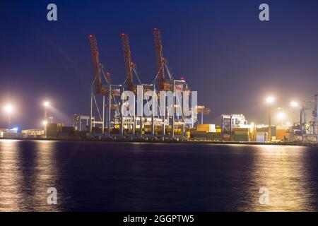 Containers loading by crane in the night , Trade Port. container ...