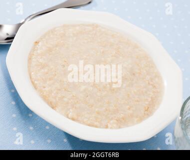 Boiled oatmeal. Dietary concept Stock Photo - Alamy