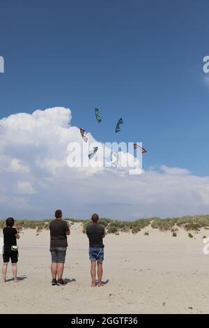 six kites fly on a blue sky Stock Photo - Alamy
