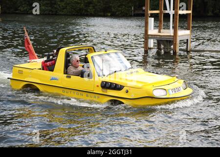 A vintage amphibious Dutton car travelling down the river Thames at the ...