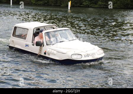 A vintage amphibious Dutton car travelling down the river Thames at the ...