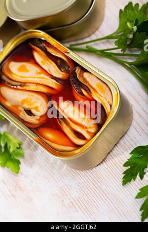 Marinated mussels in open jar on white background Stock Photo - Alamy