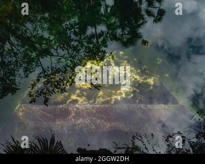 Reflection of clouds on water of the Yax Kin natural pond, to 13 km ...