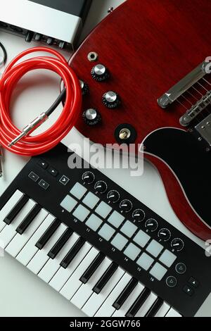 Set of different musical instruments and microphone on white background ...