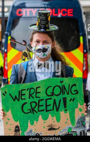 London, UK. 3rd Sep, 2021. A young protester with her hand painted ...