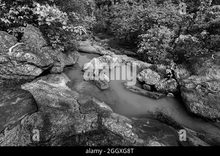 Beautiful Bamni waterfall having full streams of water flowing downhill ...