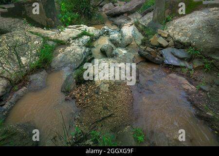 Beautiful Bamni waterfall having full streams of water flowing downhill ...