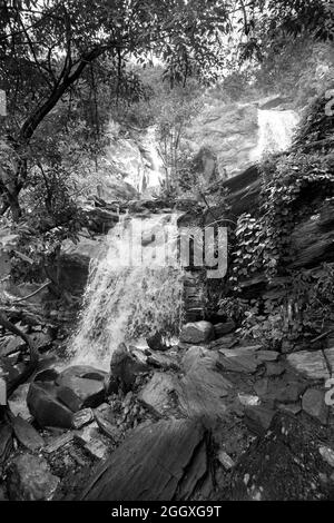 Beautiful Bamni waterfall having full streams of water flowing downhill ...