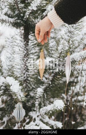 Hand putting card in time clock cut out on white background Stock Photo ...