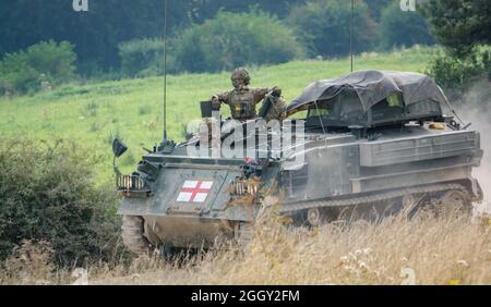British army FV432 Bulldog armored personnel carrier in action on a ...
