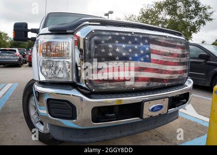 Pickup truck with a giant American Flag embedded in the front grille ...