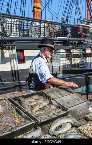 This scene is of a Victorian era Fish-monger at the quayside by the ...