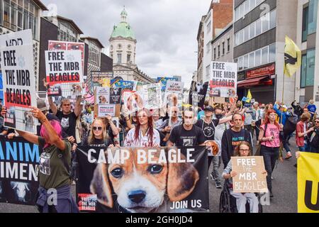 August 28, 2021, London, United Kingdom: Protesters hold banners and ...
