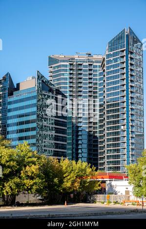 A cluster of modern office buildings in Tokyo, Japan, featuring sleek ...