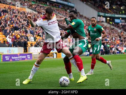 Bradford City's Andy Cook (left) scores their side's first goal of the ...