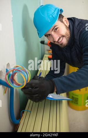 Electrician snipping a wire Stock Photo - Alamy