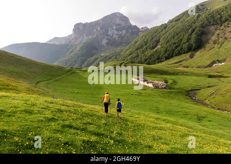 Mother and son, tourists, hikers exploring The Accursed Mountains ...
