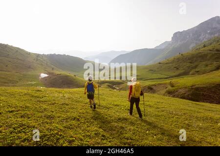 Mother and son, tourists, hikers exploring The Accursed Mountains ...