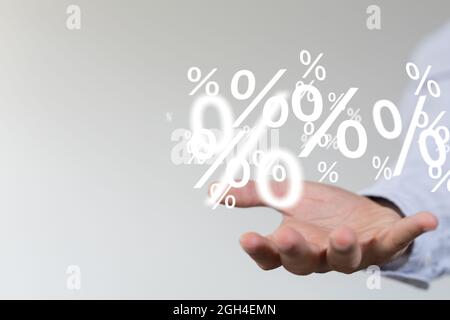 An illustration of digital percentage icons in hands Stock Photo - Alamy