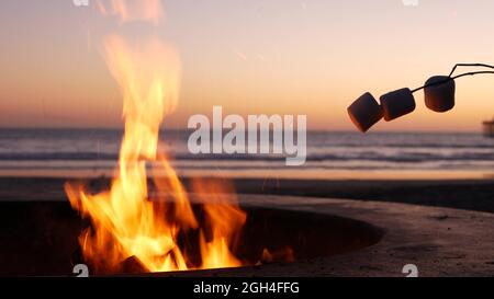 Campfire pit by Oceanside pier, California USA. Camp fire burning on ...