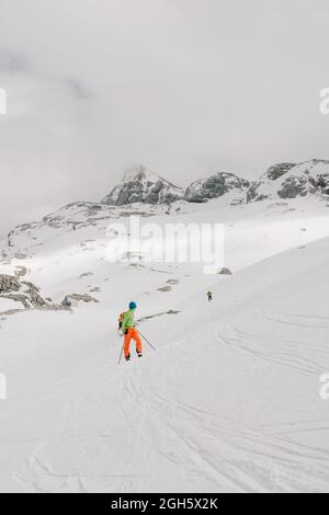 Anonymous athlete on skis on Pico Aunamendi in snowy Pyrenees Mountains ...