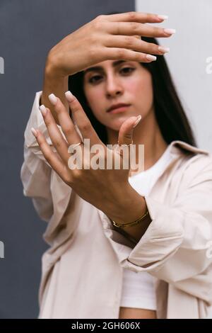 Woman reaching out with both hands towards the viewer Stock Photo - Alamy