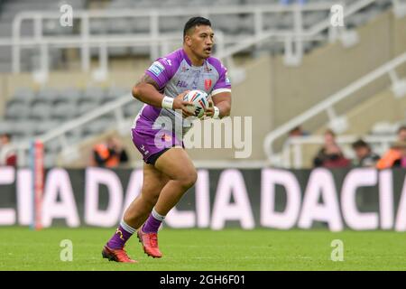 Albert Vete #8 of Hull KR runs at Kaide Ellis #15 of Wigan Warriors in ...