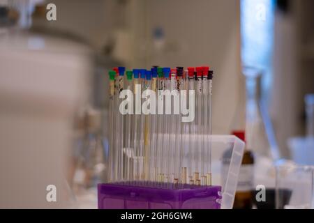 Nuclear magnetic resonance NMR tube kept in a line in box for chemical ...