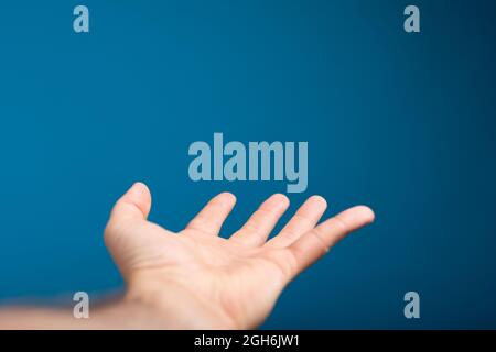 A male outstretched hand with an open palm Stock Photo - Alamy