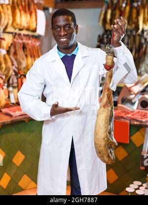 Portrait of positive man jamon seller Stock Photo - Alamy