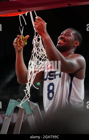 Brian Bell (USA) of Team USA cuts the basketball hoop net to celebrate ...