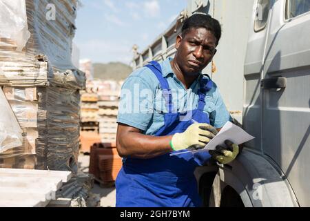 Driver keeps records of materials when loading into back of truck at ...