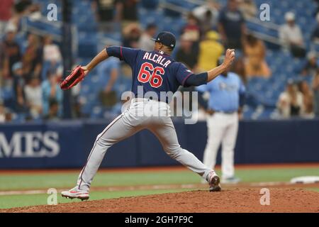 Minnesota Twins pitcher Jorge Alcala throws to first to force out ...