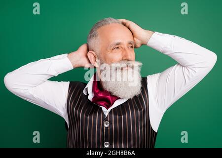 Photo of neat dandy cheerful man hands touch fix bowtie beaming smile ...