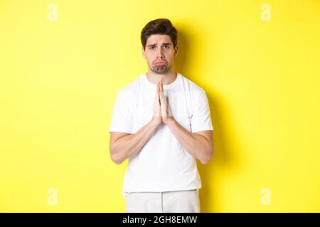 Sad guy begging for something, sulking and asking for favour, saying ...