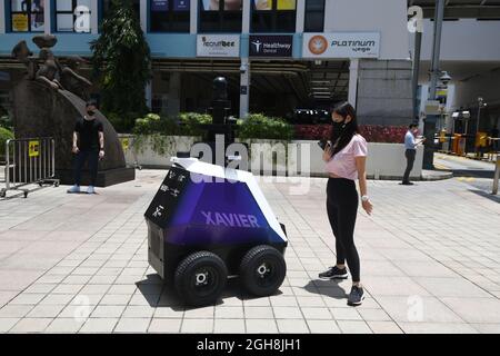 An HTX (Home Team Science and Technology Agency) ground robot, named ...
