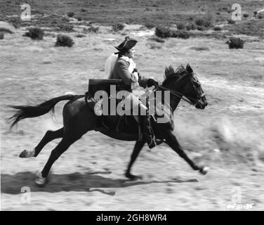 LAURENCE OLIVIER as Captain MacHeath on his horse in THE BEGGAR'S OPERA ...