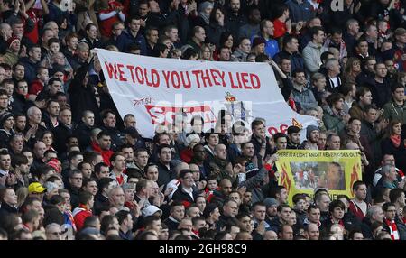 Fans hold up a banner during the World Cup Group G soccer match between ...